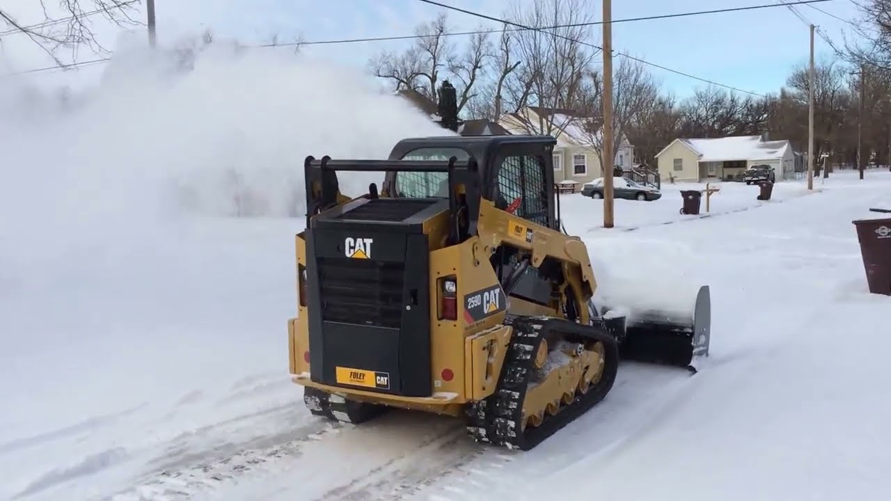 Cat 259d On Tracks Throwing Snow Clearing The Streets Youtube