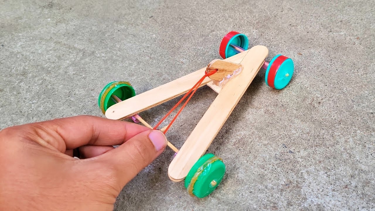 How To Make Rubber Band Powered Car Very Easy Youtube