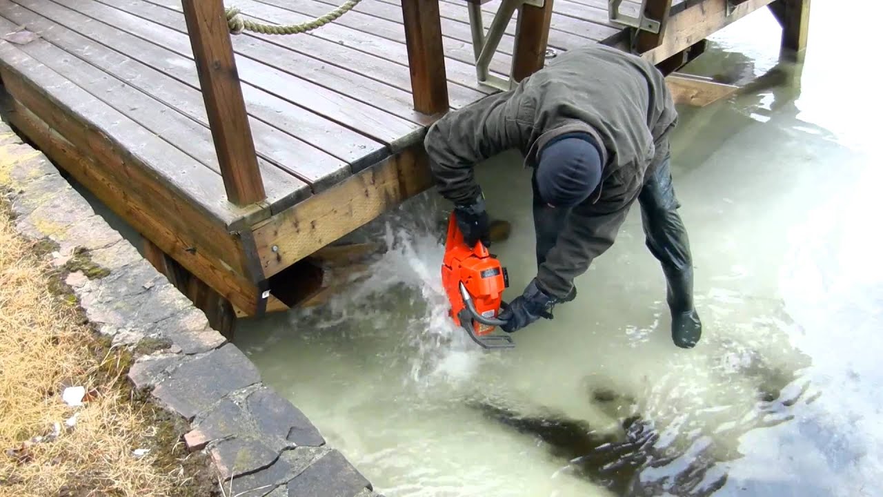Chain Saw Used To Cut Ice Around Dock Canada Youtube