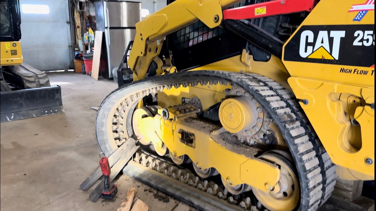How To Install New Skid Loader Tracks On The Cat 259d Youtube