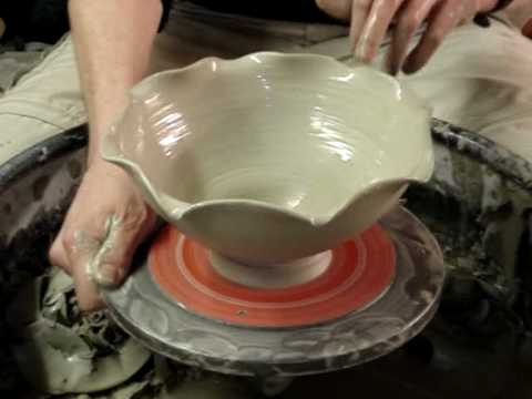 Attempting To Make A Clay Pottery Flower Shaped Bowl On A Potters Wheel