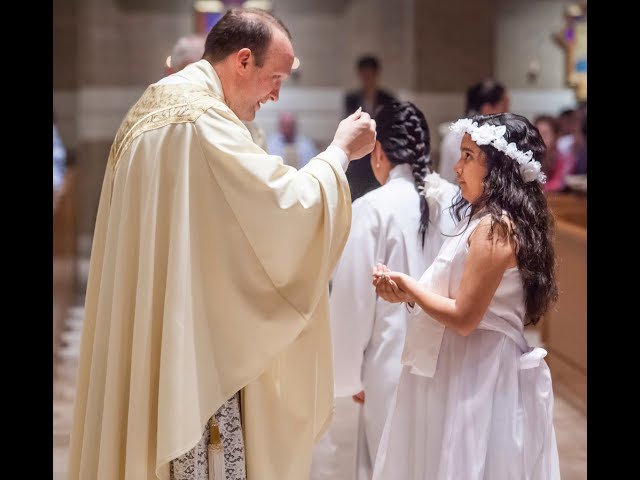 Receiving First Holy Communion