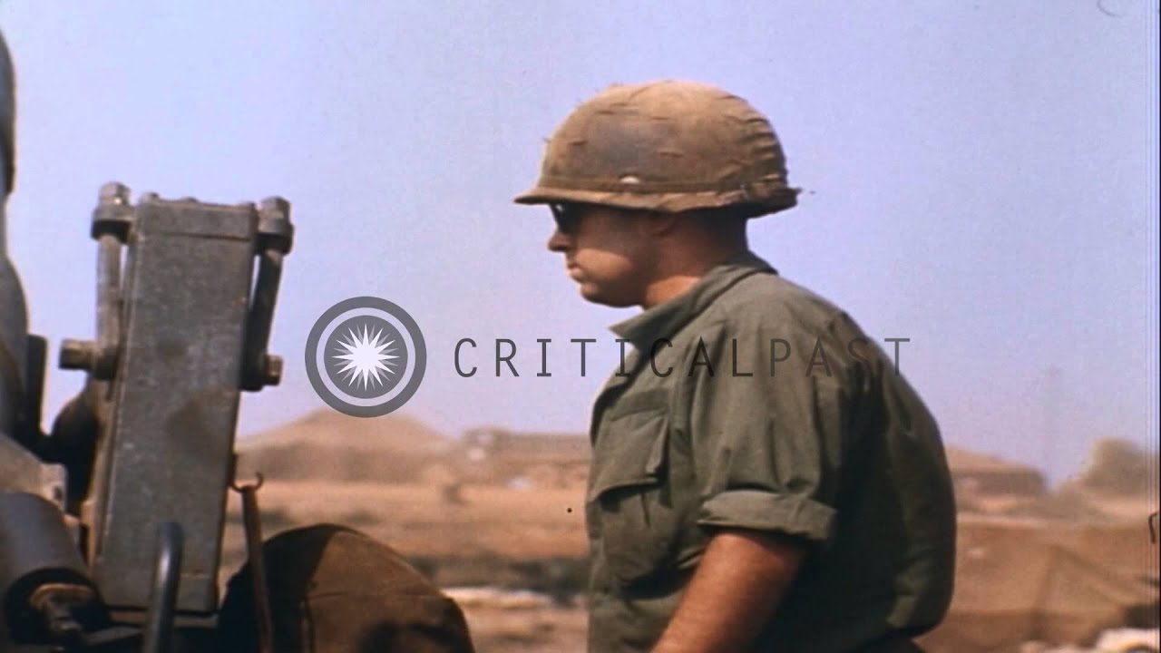 1st Air Cavalry Division Troops Load And Fire M 110 Howitzer At Camp