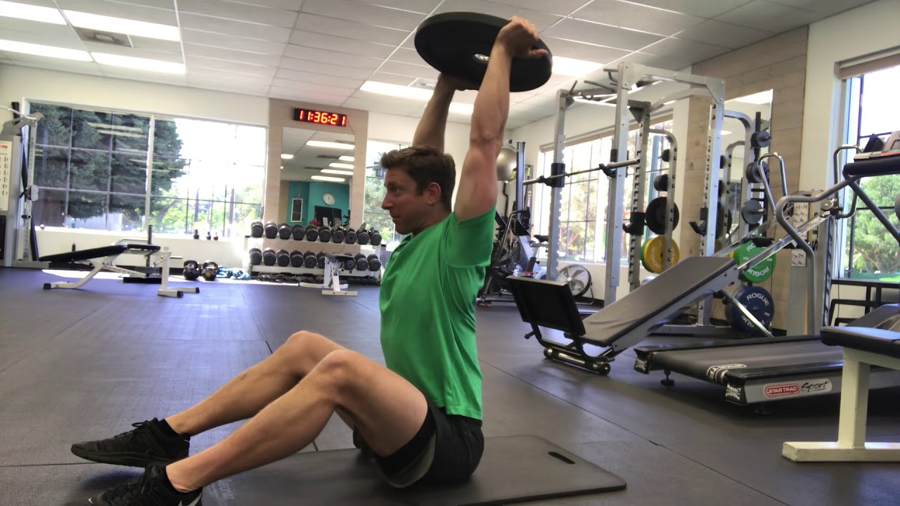 Plate Sit Up With Overhead Press Exercise Youtube